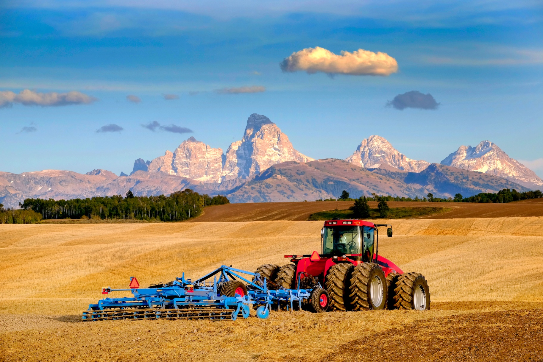 Farm tractor with GPS tracking in field